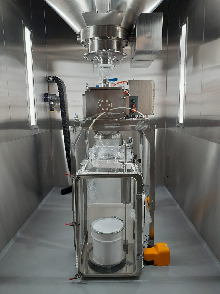 Contained Unloading System for a Rotating dryer trough a mill.